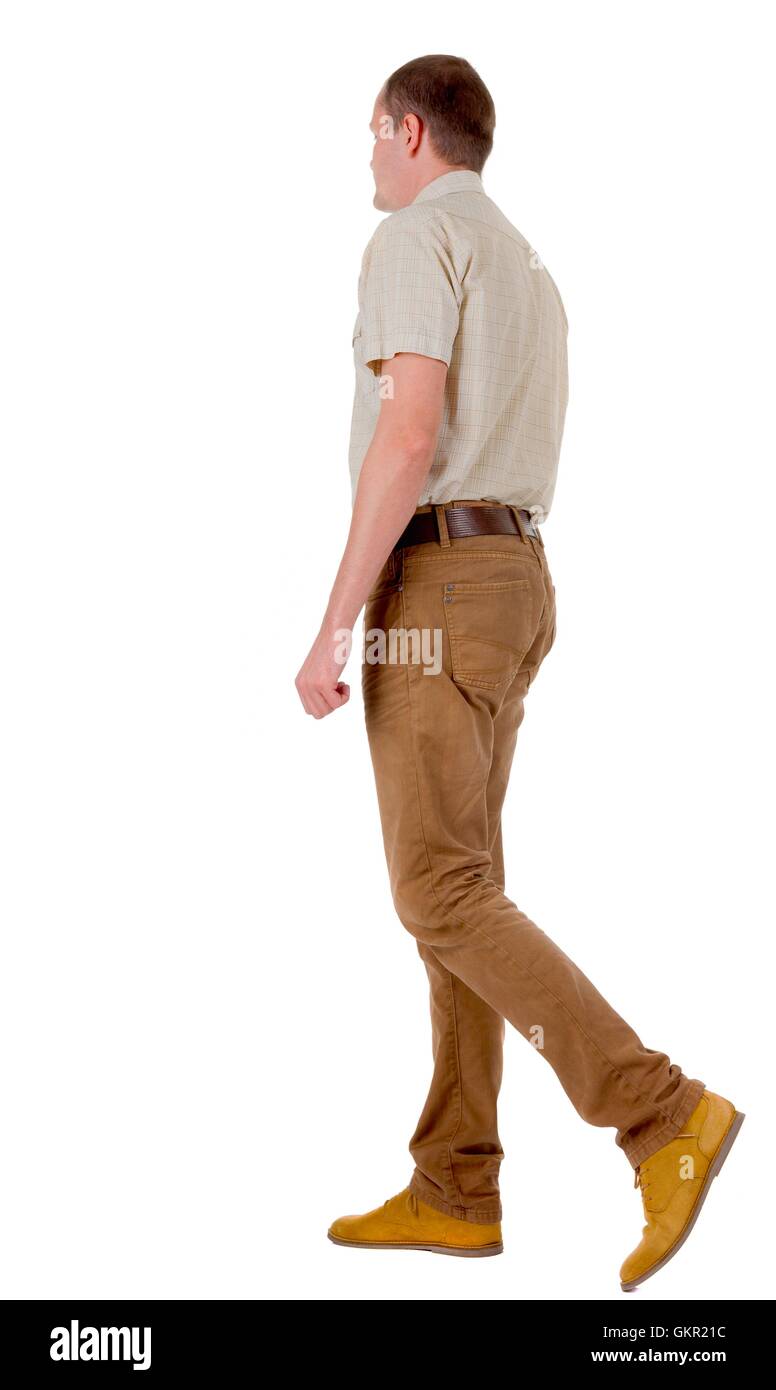 Back view of going handsome man in jeans and a shirt Stock Photo - Alamy