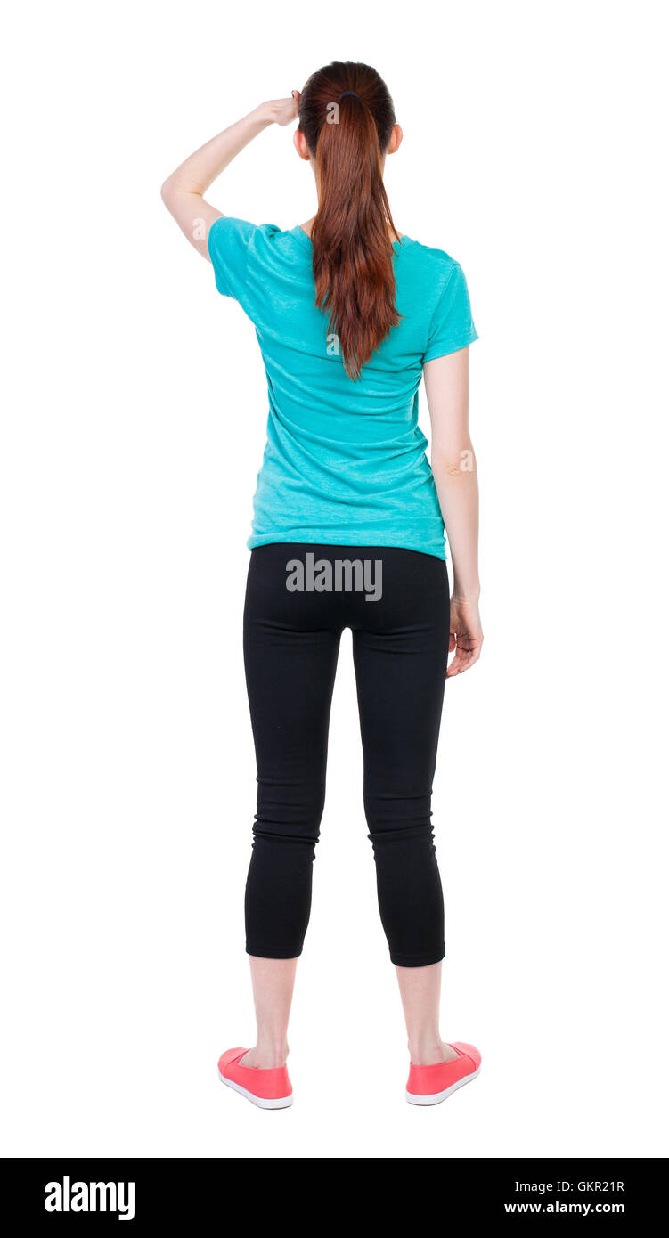 back view of standing young beautiful woman. girl watching Stock Photo ...
