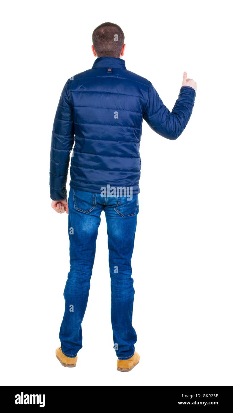 Back view of man in blue jacket shows thumbs up Stock Photo - Alamy