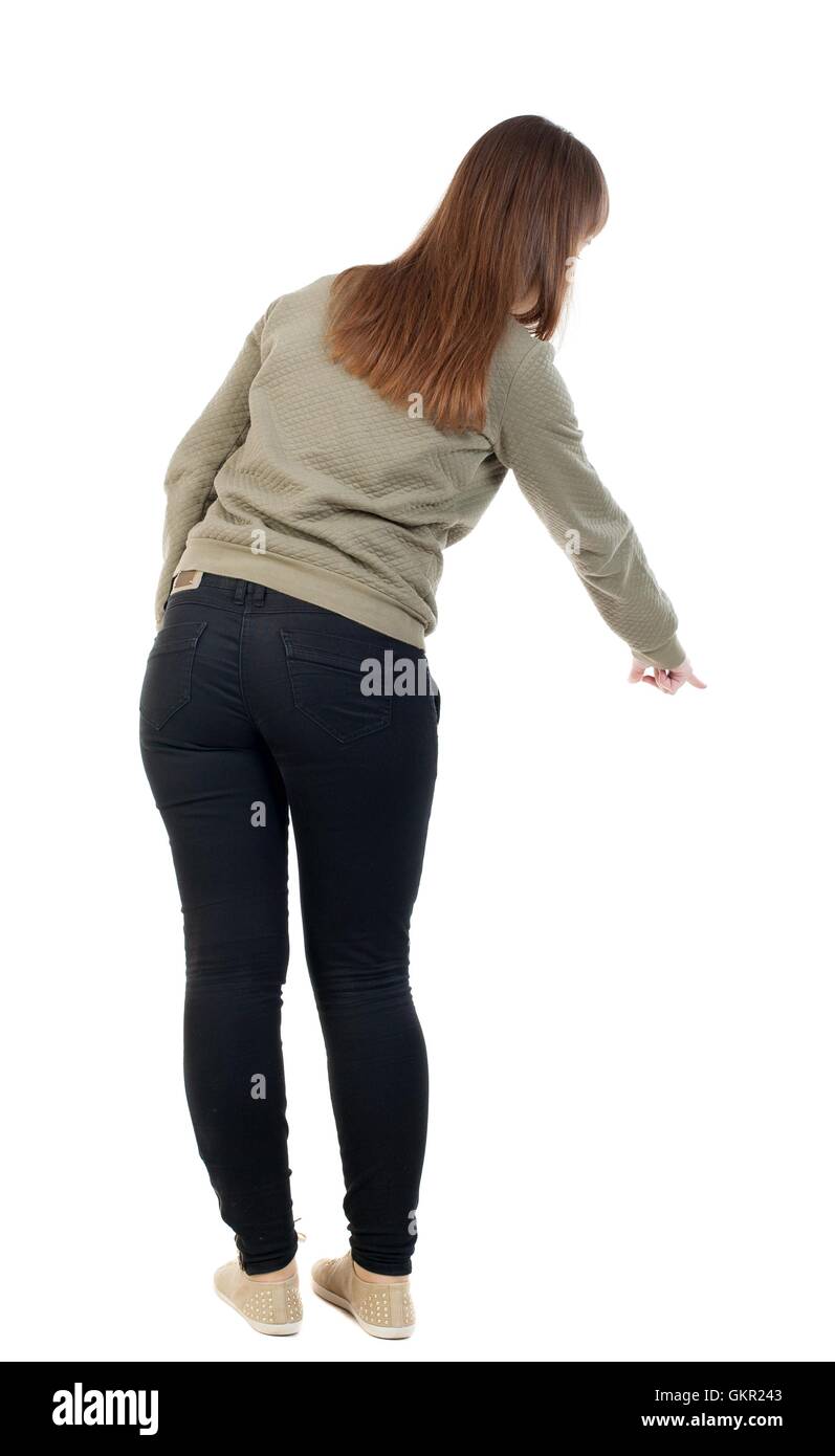 Back view of pointing woman Stock Photo - Alamy