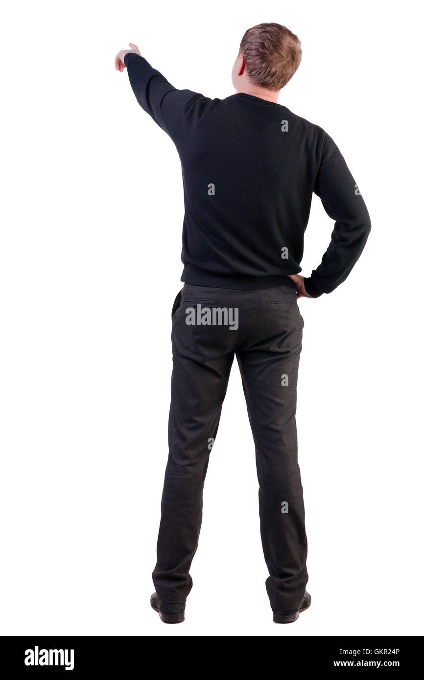 Back view of pointing young business men in sweater Stock Photo - Alamy