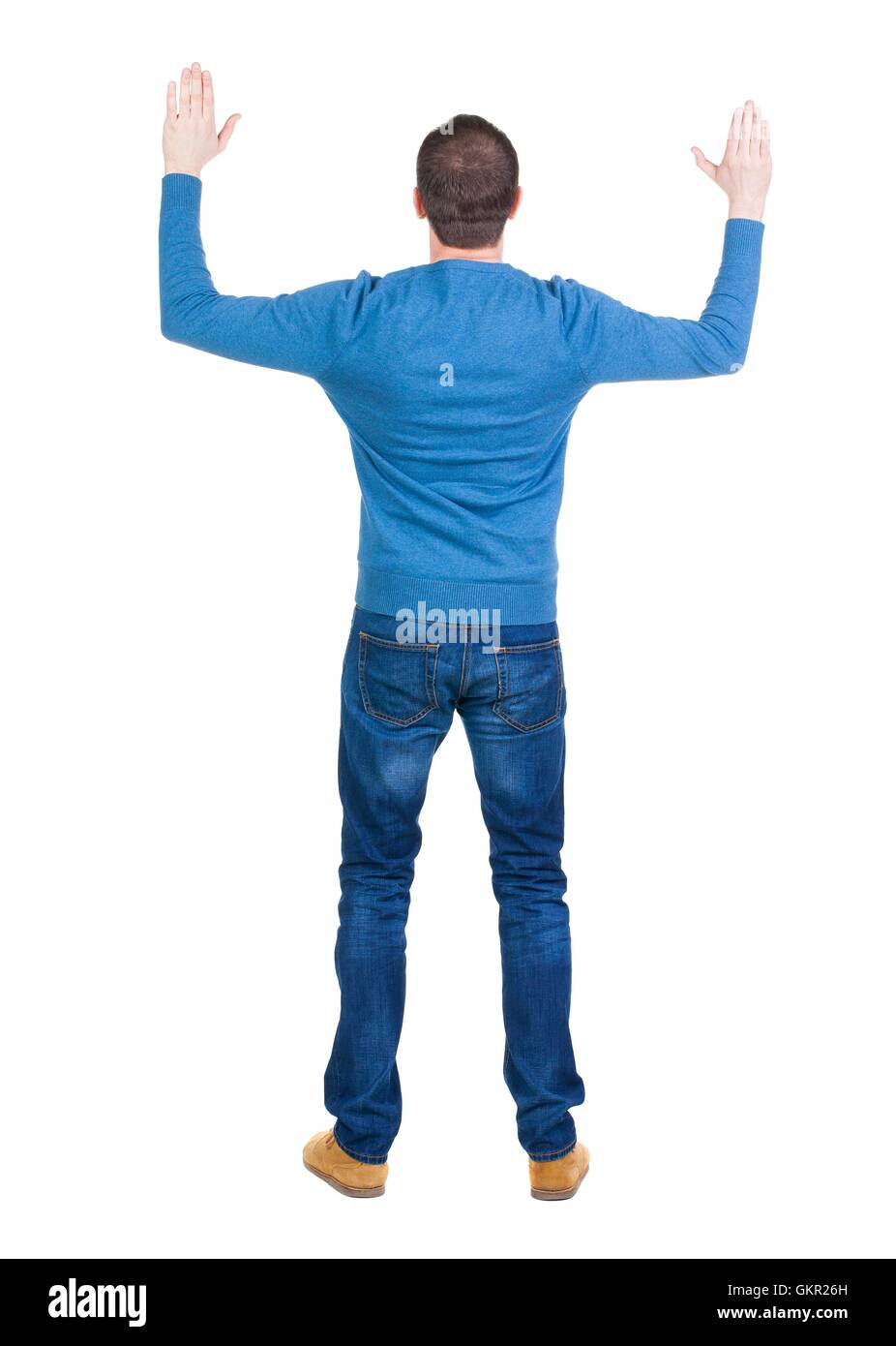Back view of handsome man in blue pullover looking up Stock Photo - Alamy