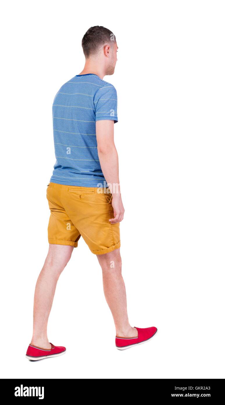 Back view of going handsome man in shorts. walking young guy Stock ...