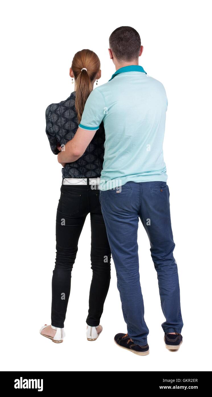 Back view of young embracing couple Stock Photo - Alamy