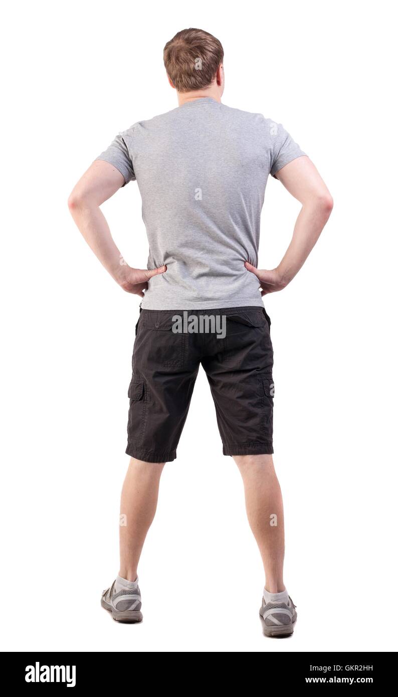 Back view of handsome man in t-shirt and shorts looking up Stock Photo ...