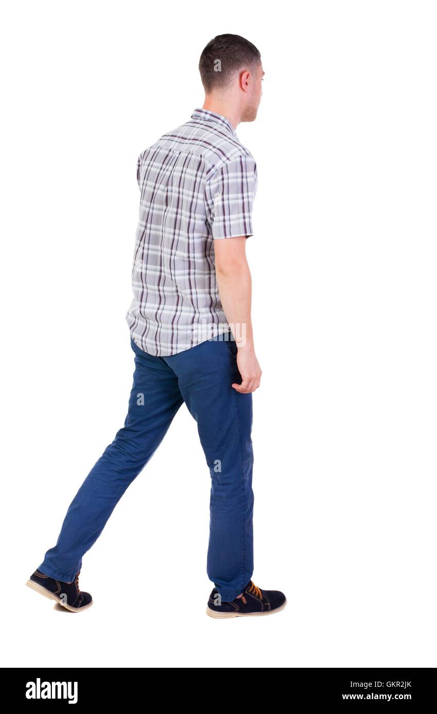 Back view of going handsome man in jeans and a shirt Stock Photo - Alamy