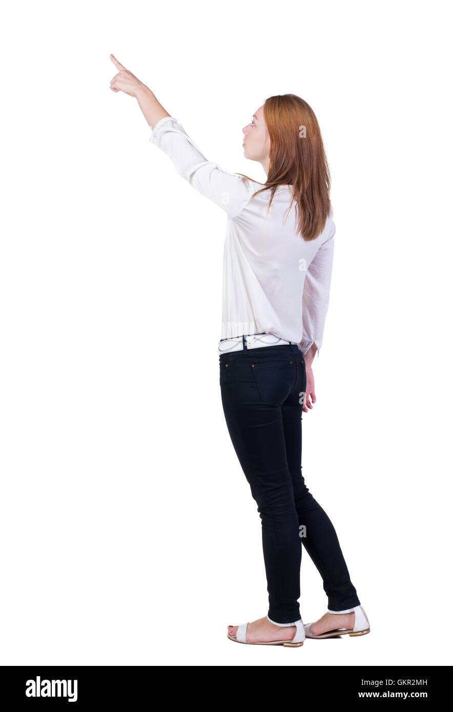 Back view of pointing woman Stock Photo - Alamy
