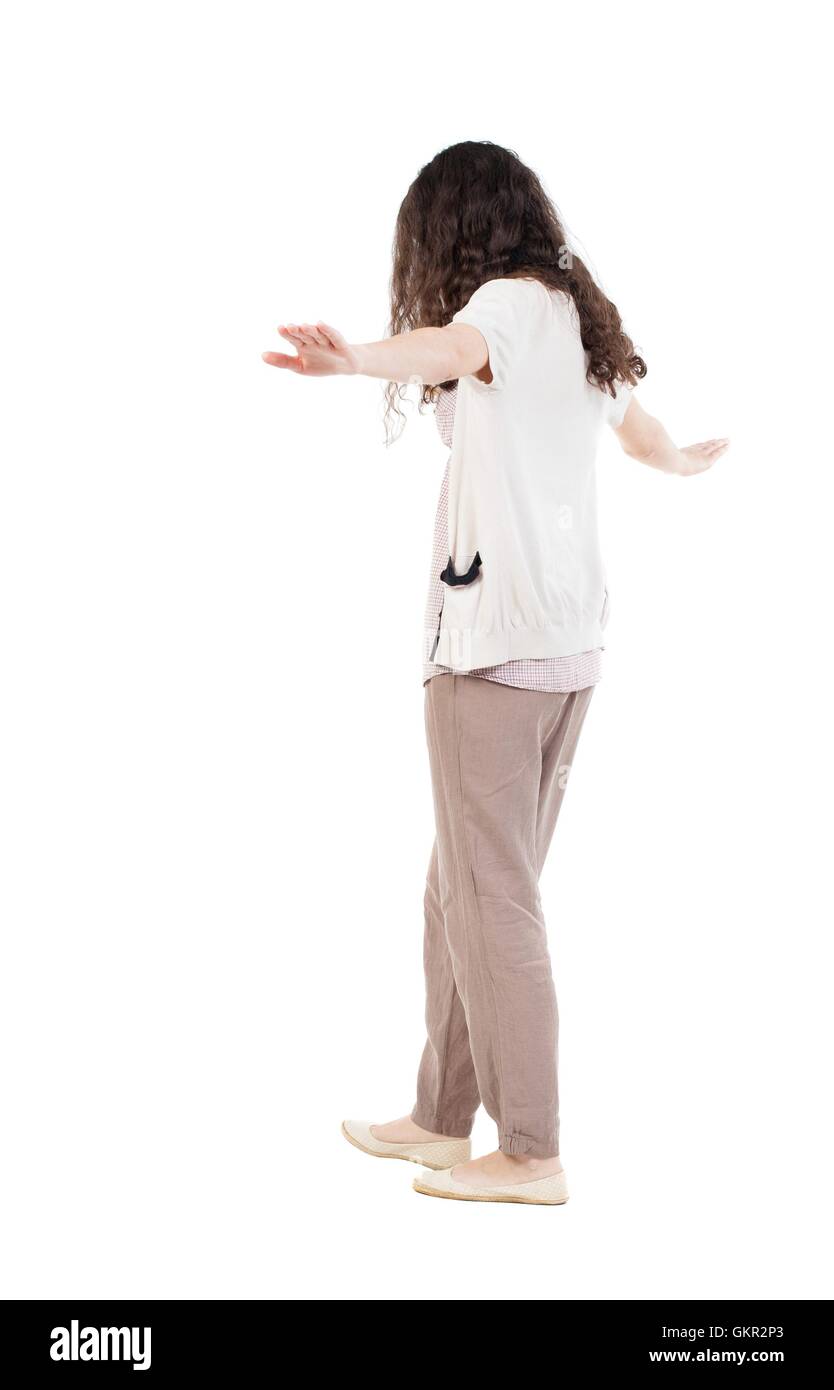 Back view woman is balancing on a tightrope Stock Photo - Alamy