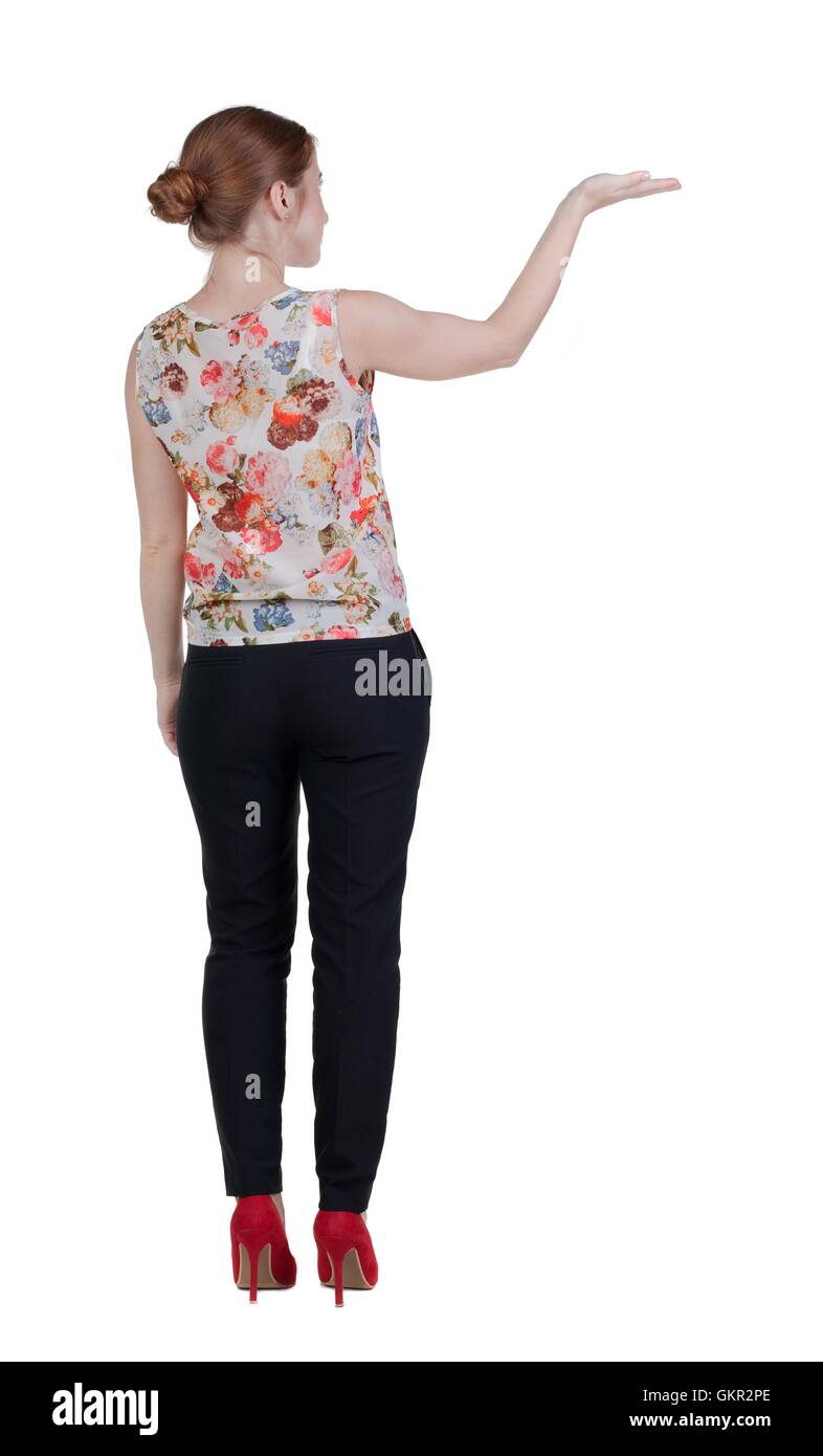 Back view of Beautiful business woman in suite looking at wall and ...