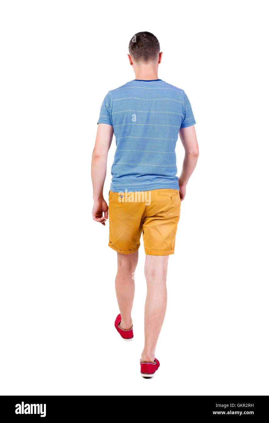 Back view of going handsome man in shorts. walking young guy Stock ...
