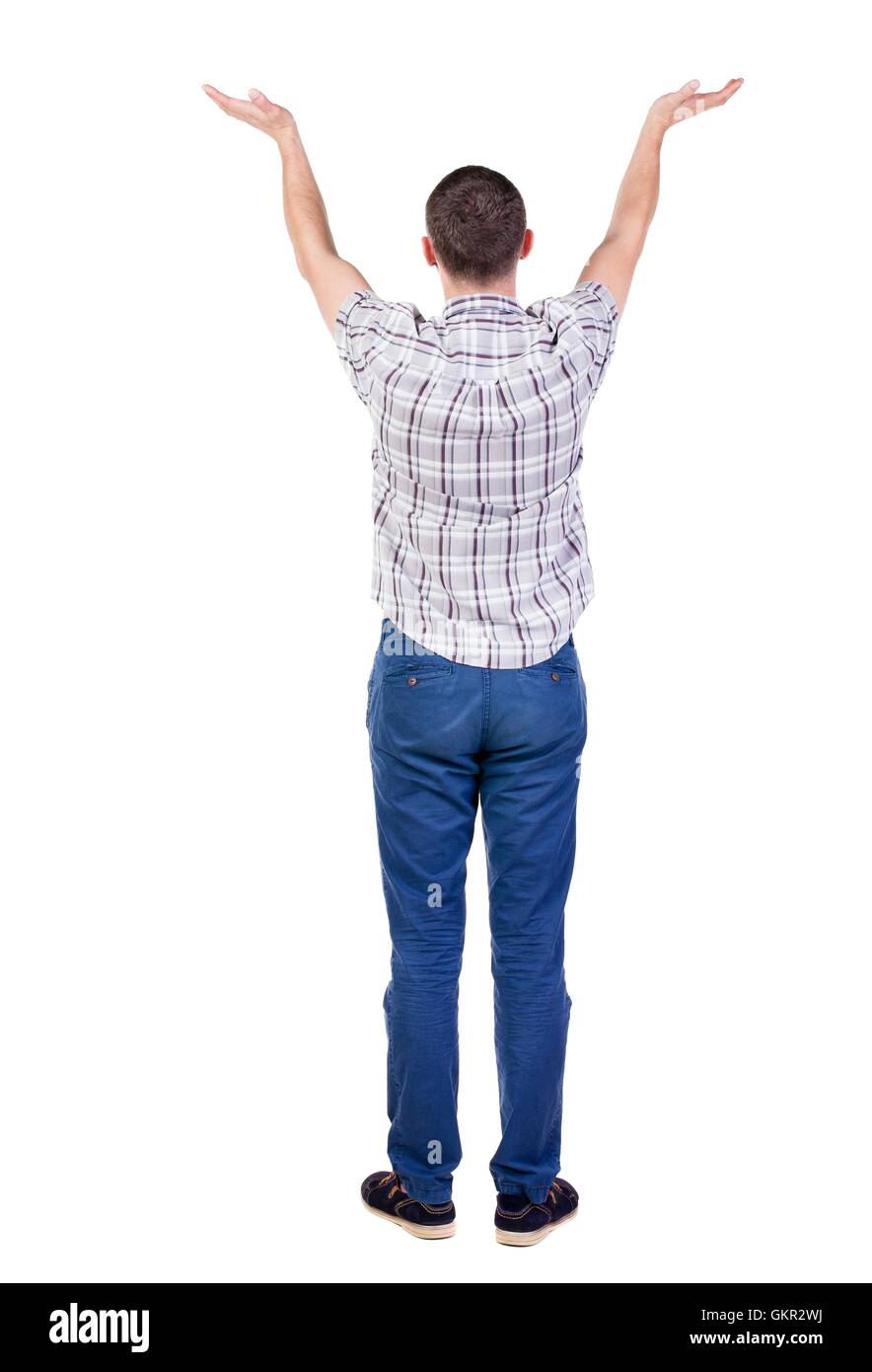 Back view of Beautiful man in jeans looking at wall and Holds h Stock ...