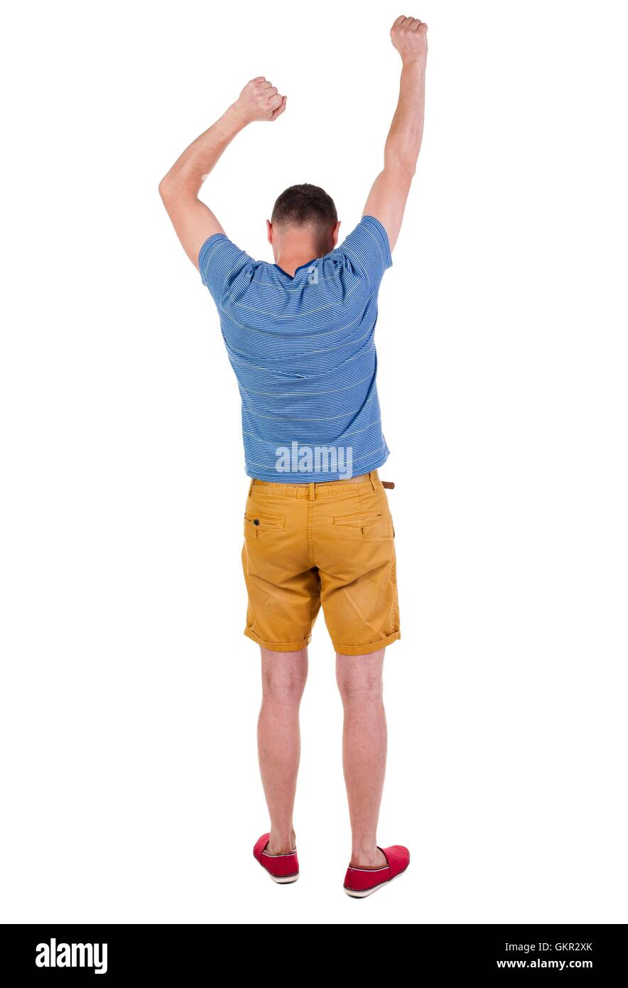 Back view of joyful man celebrating victory hands up Stock Photo - Alamy