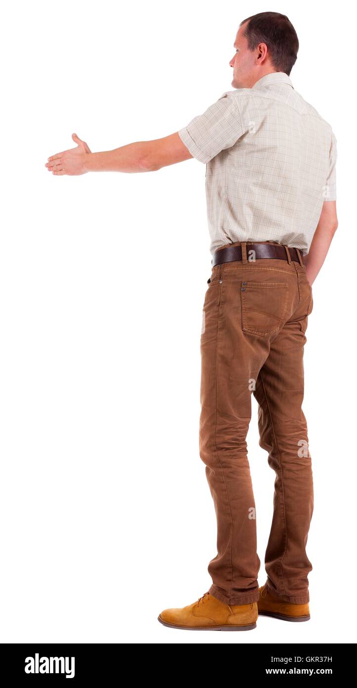 back view of businessman in movement reaches out to shake hands Stock ...