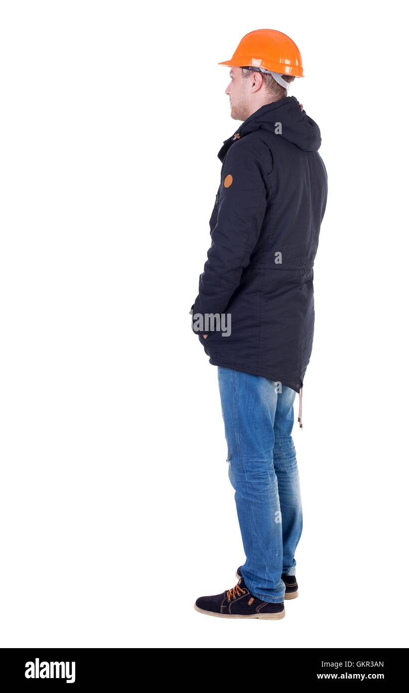Back view of an engineer in construction helmet stands Stock Photo - Alamy