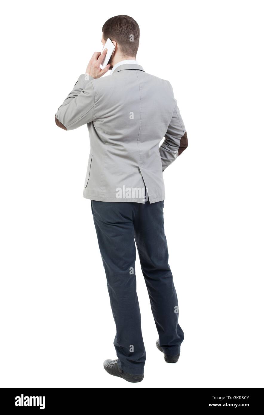 back view of business man in suit talking on mobile phone Stock Photo ...