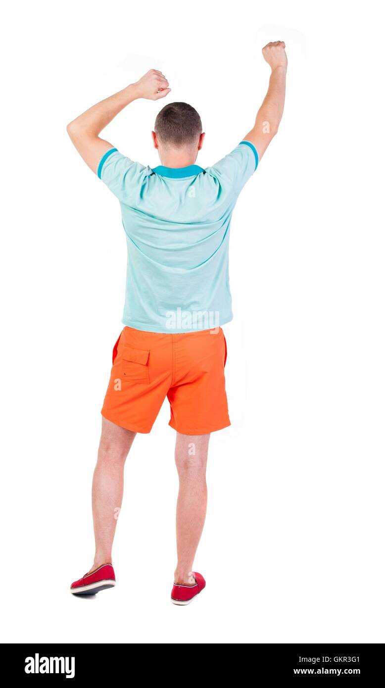 Back view of joyful man celebrating victory hands up Stock Photo - Alamy