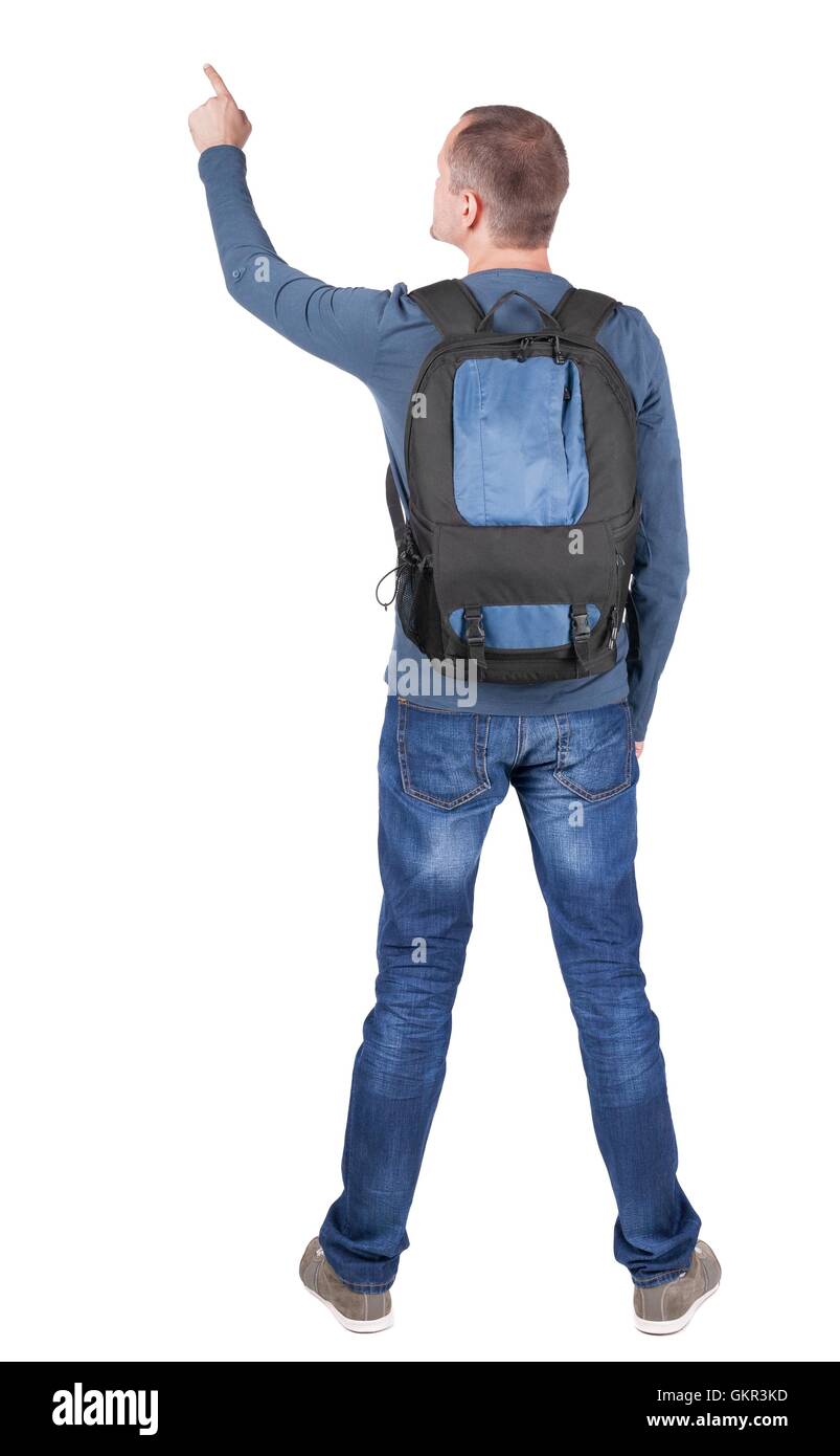 Back view of man with backpack pointing hi-res stock photography and ...