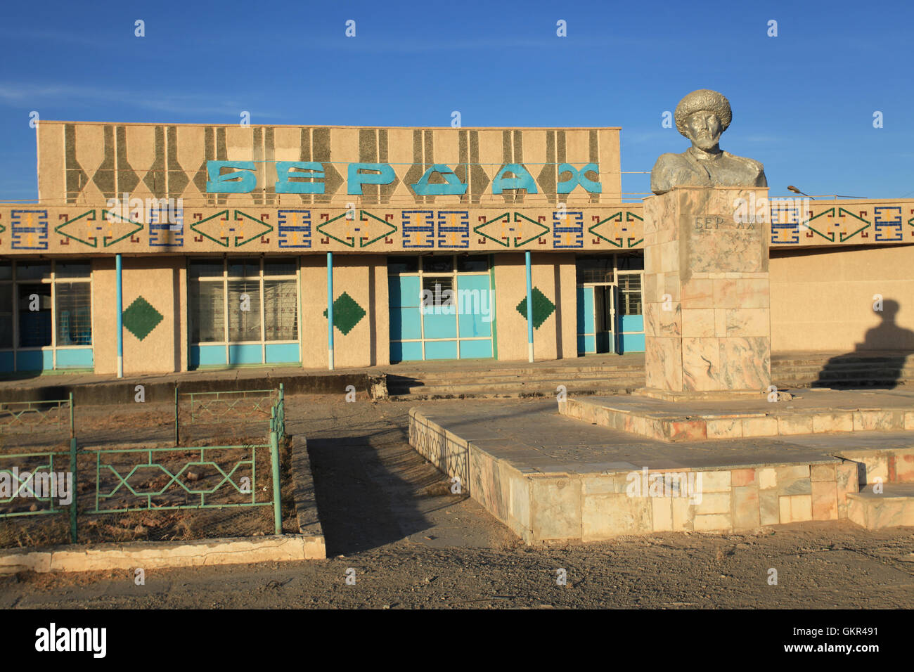 Statue of Berdakh in front of the theatre in the town center of Moynak ...