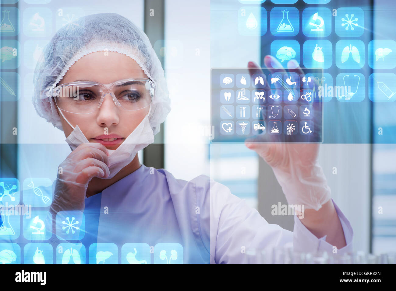 Woman doctor pressing buttons with various medical icons Stock Photo ...