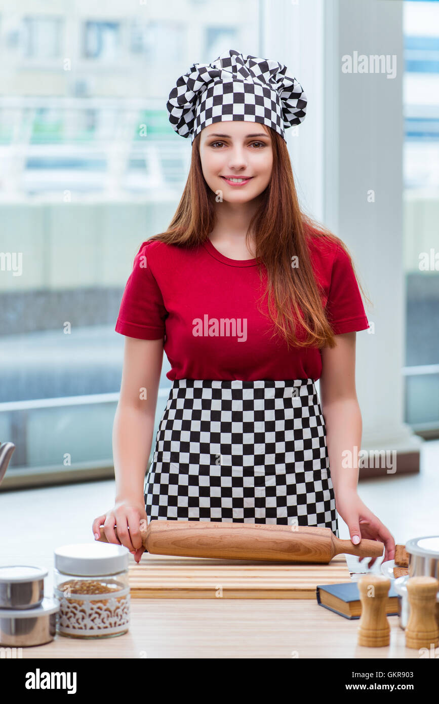 Woman with rolling pin isolated on white Stock Photo - Alamy