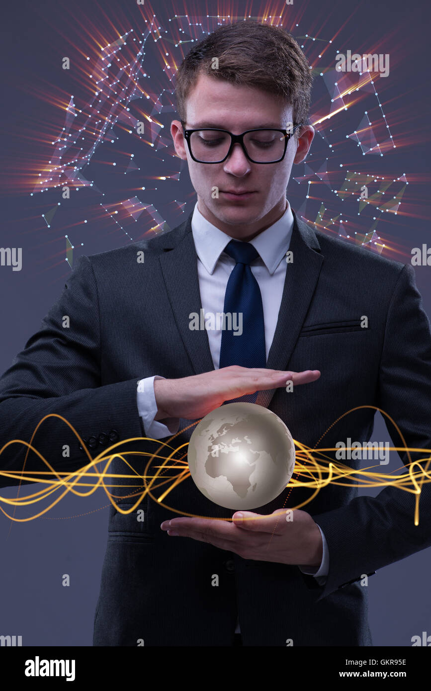 Young businessman in globalisation concept holding earth Stock Photo ...