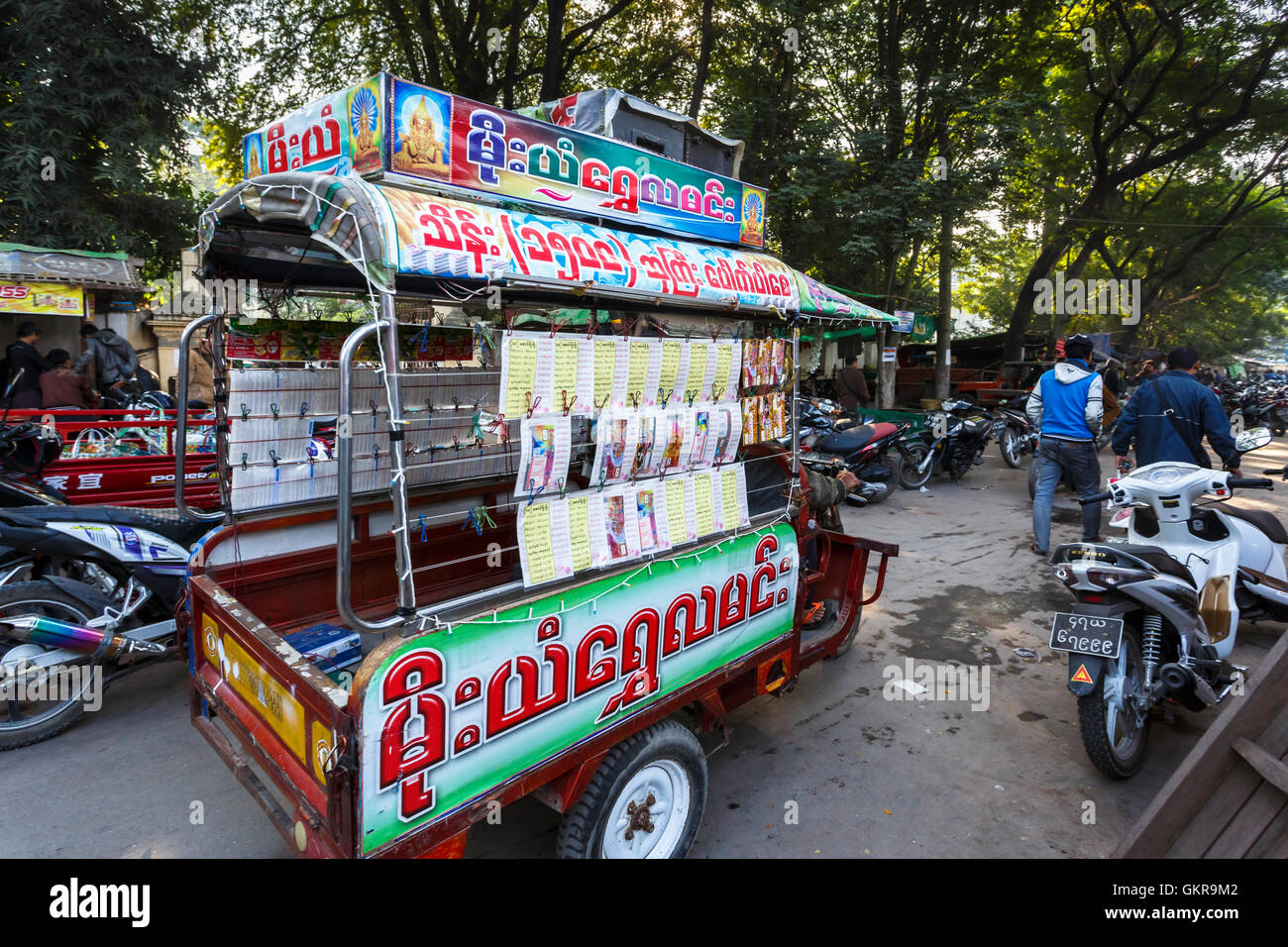 Three wheeled vehicle selling lottery tickets in the street at the Jade ...