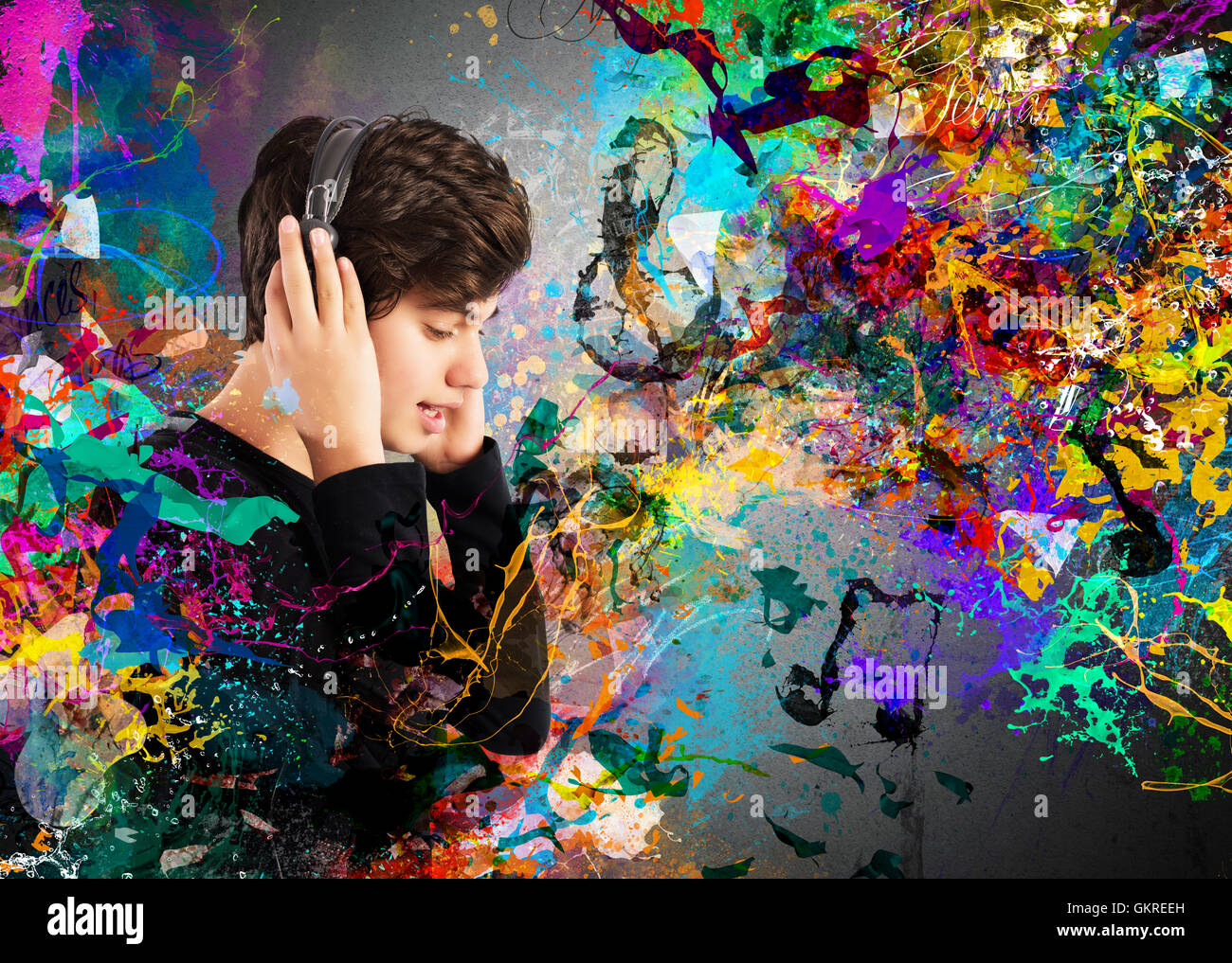 Teen boy listens to music with headphones Stock Photo - Alamy