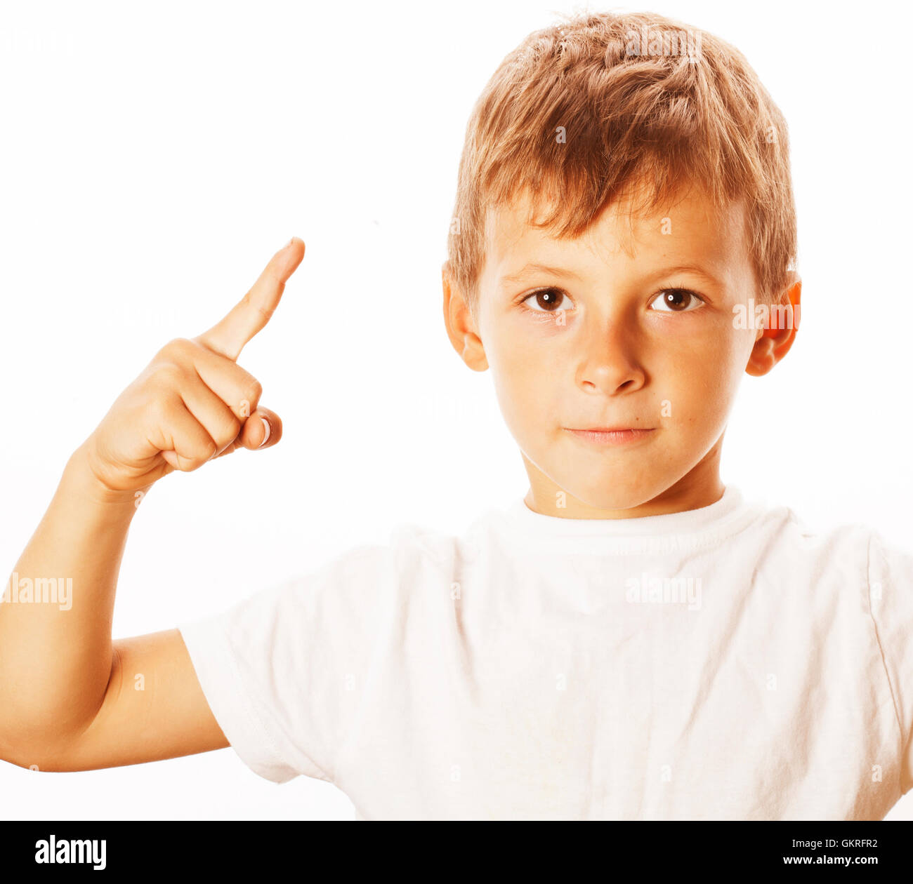 little cute white boy pointing in studio isolated close up Stock Photo ...