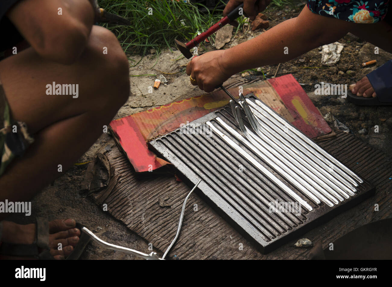 Thai people lead Ingots in pot local thai style for solder radiator of ...