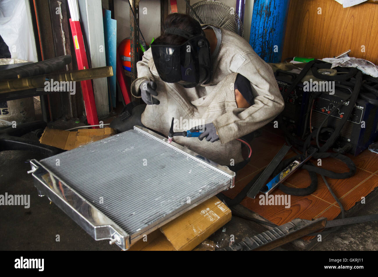 Thai people use electricity welding for fix and solder radiator of car ...