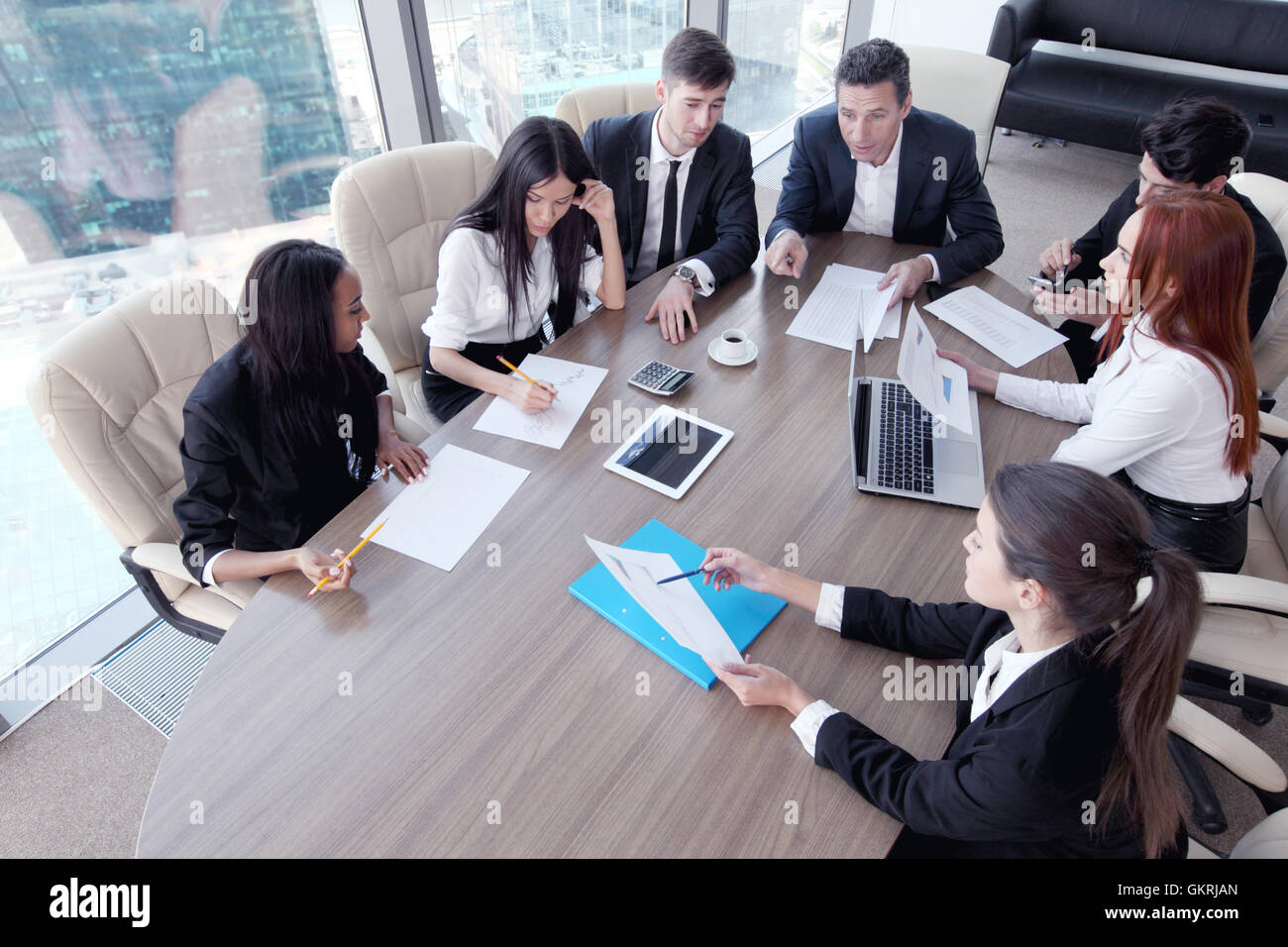 Business meeting of diverse people around the table Stock Photo - Alamy