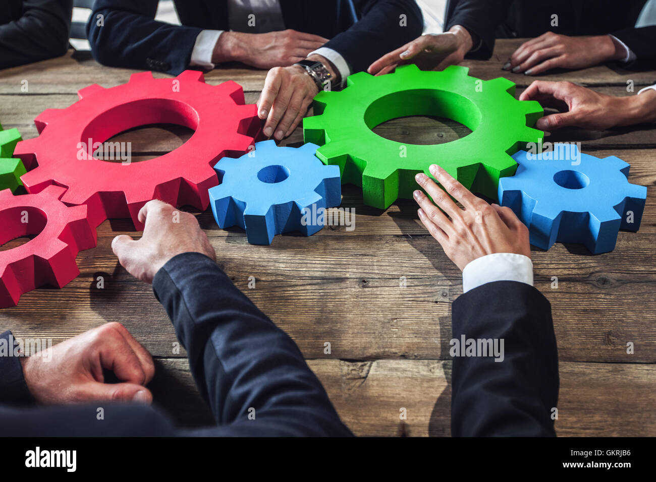 Business people with cogs of business, modern business meeting concept ...