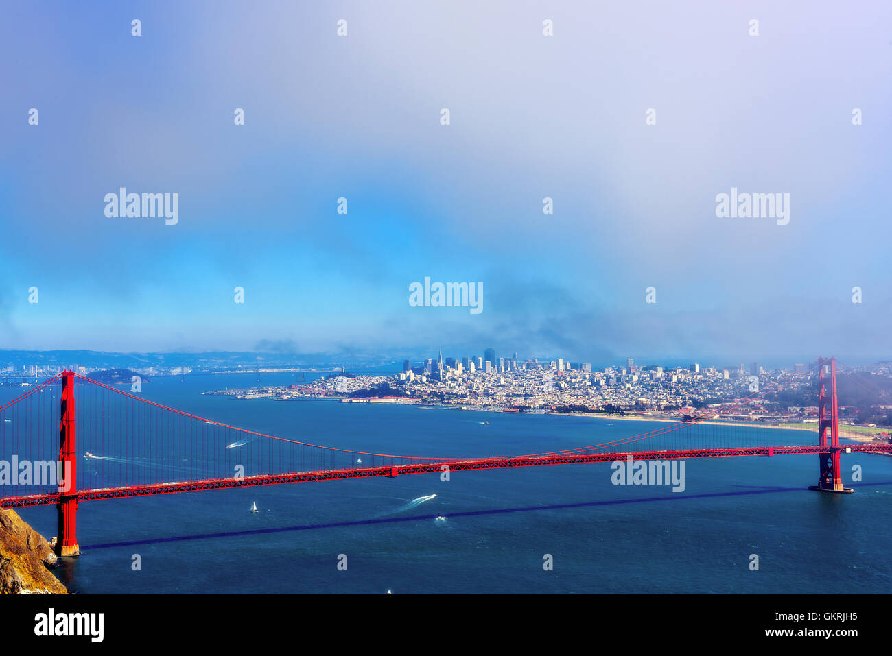 The iconic Golden Gate bridge spans the Golden Gate strait in the city ...