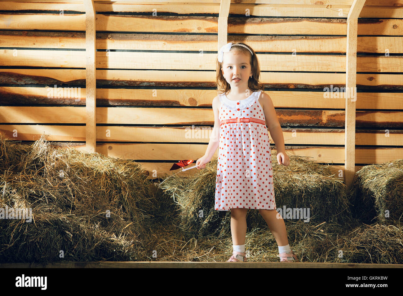 Girl on Hayloft Stock Photo - Alamy