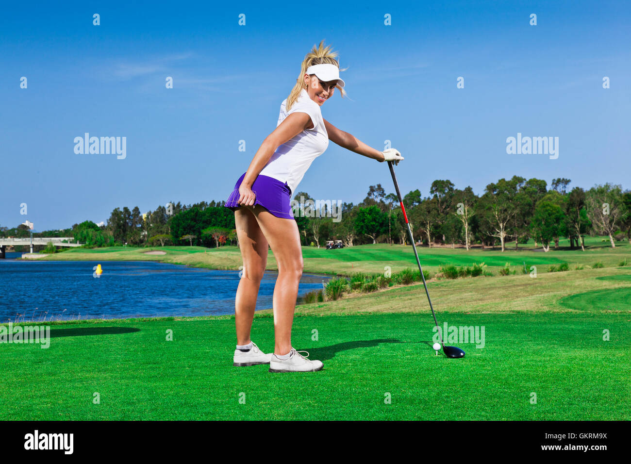 Young golfer girl Stock Photo - Alamy