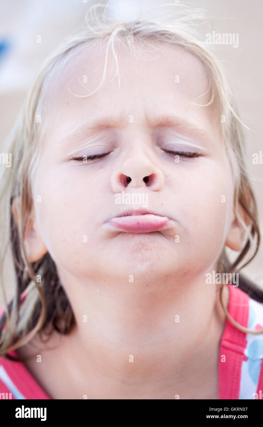 Child making silly face Stock Photo - Alamy