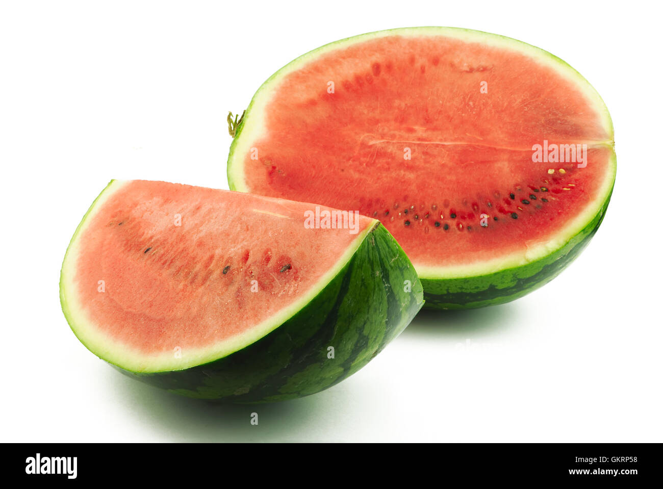Half and slice of watermelon Stock Photo - Alamy