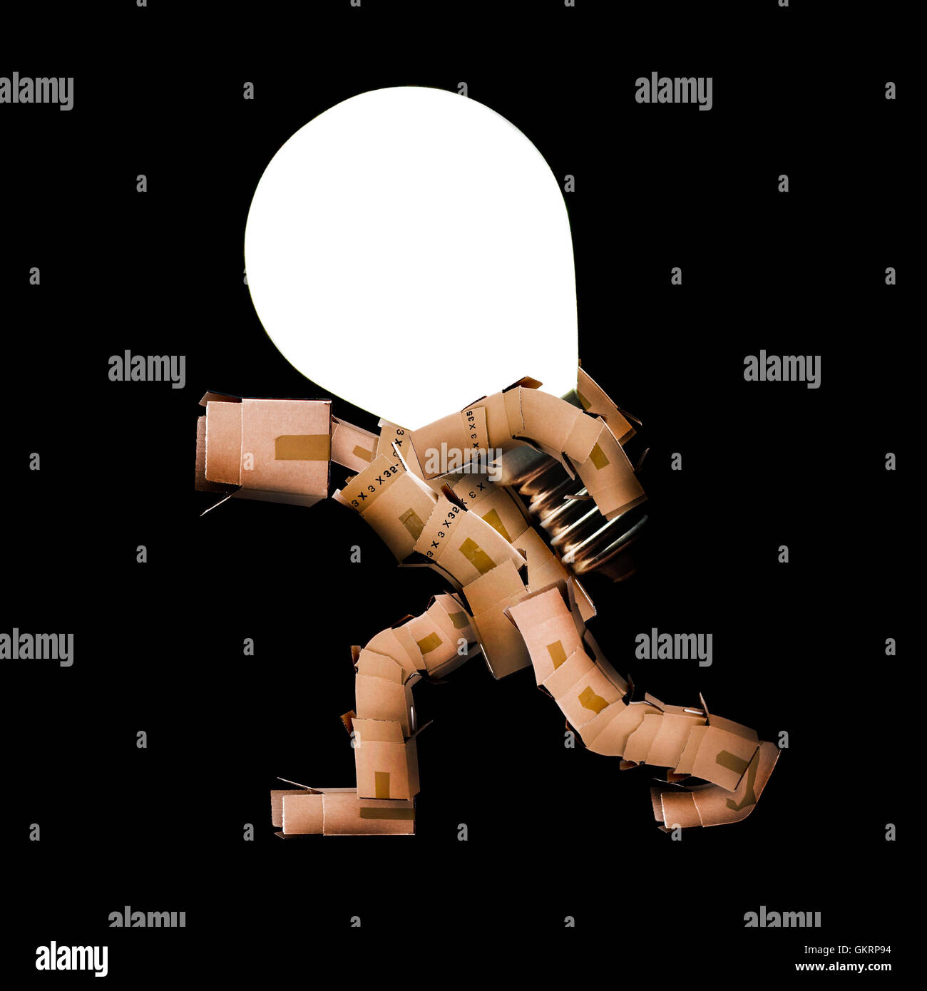 Box man carrying light bulb Stock Photo - Alamy