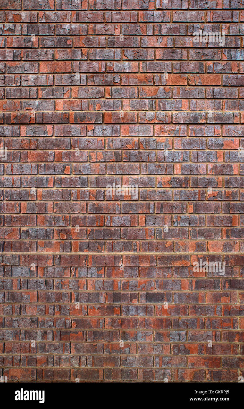 Faux used brick wall vertical Stock Photo - Alamy