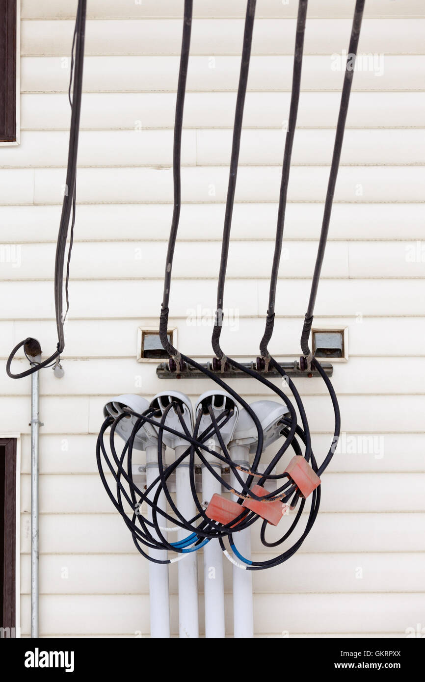 Incoming electricity junction of wires on wall Stock Photo - Alamy