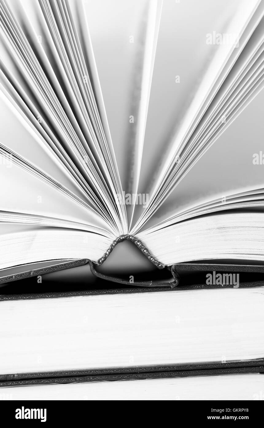 Open books table Black and White Stock Photos & Images - Alamy