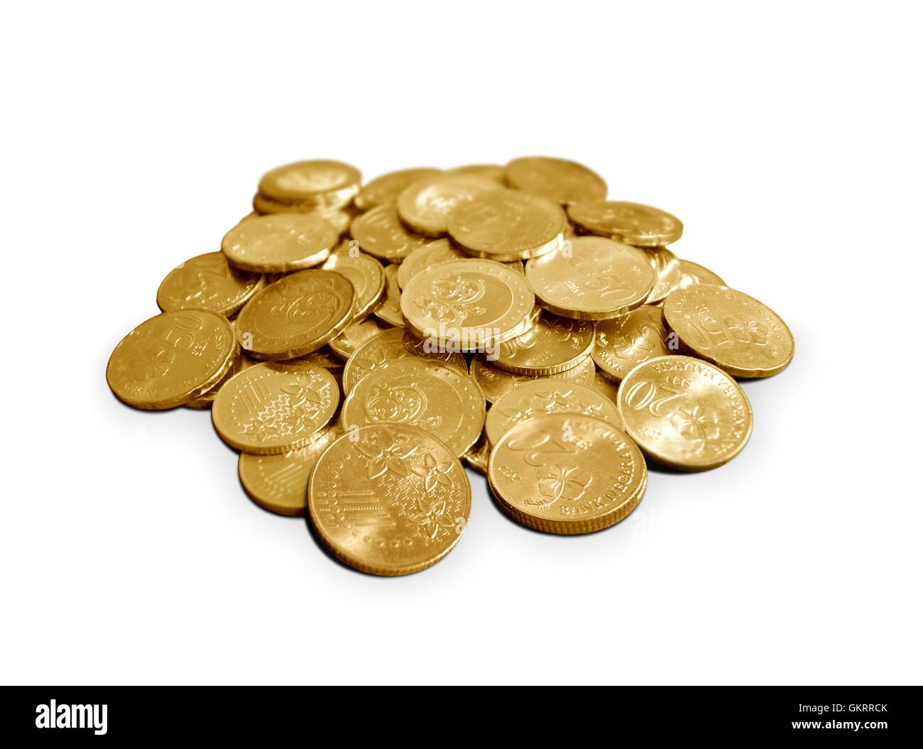 Coins in gold color over white Stock Photo - Alamy