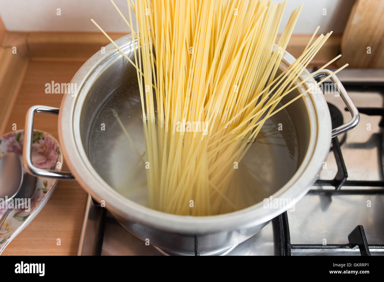 Spaghetti in pan cooking in boiling water Stock Photo - Alamy