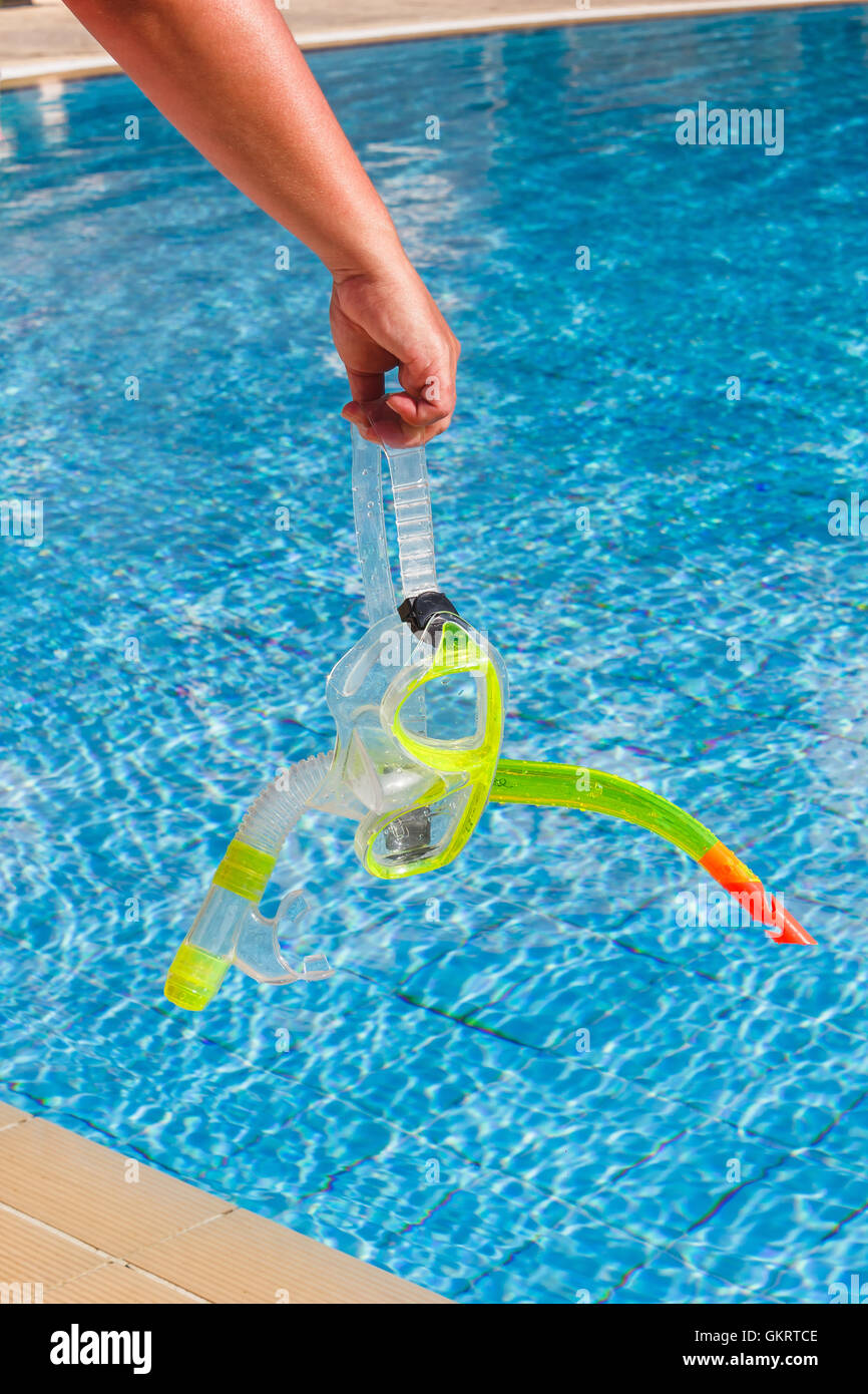 Mask and snorkel for diving near the pool Stock Photo - Alamy