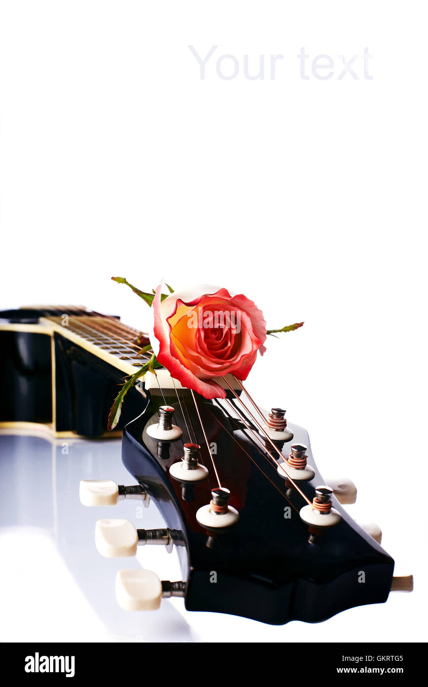 Black guitar and rose Stock Photo - Alamy