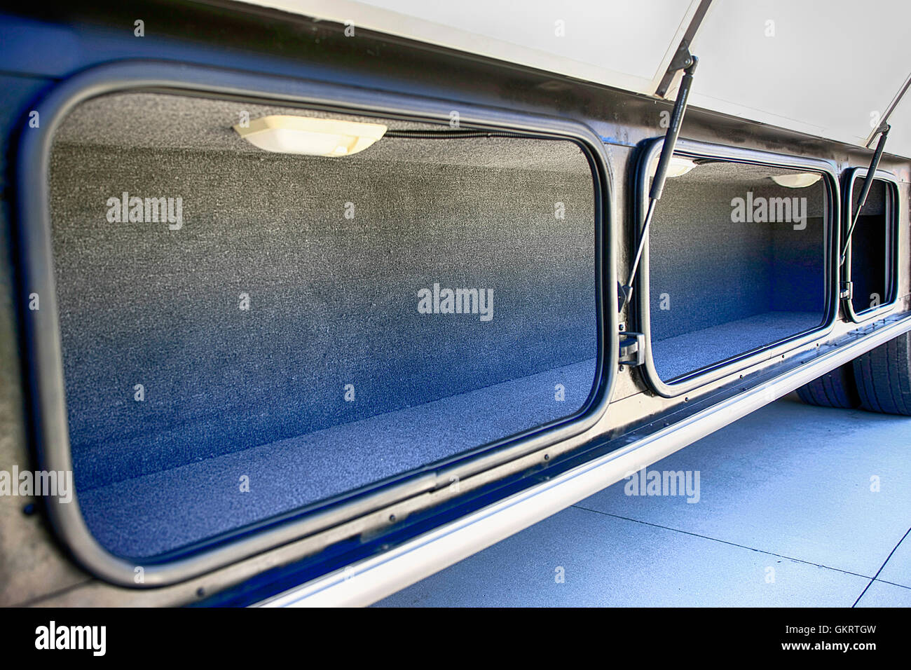 Storage lockers of a 32ft class A motorhome set up at a park in Florida ...