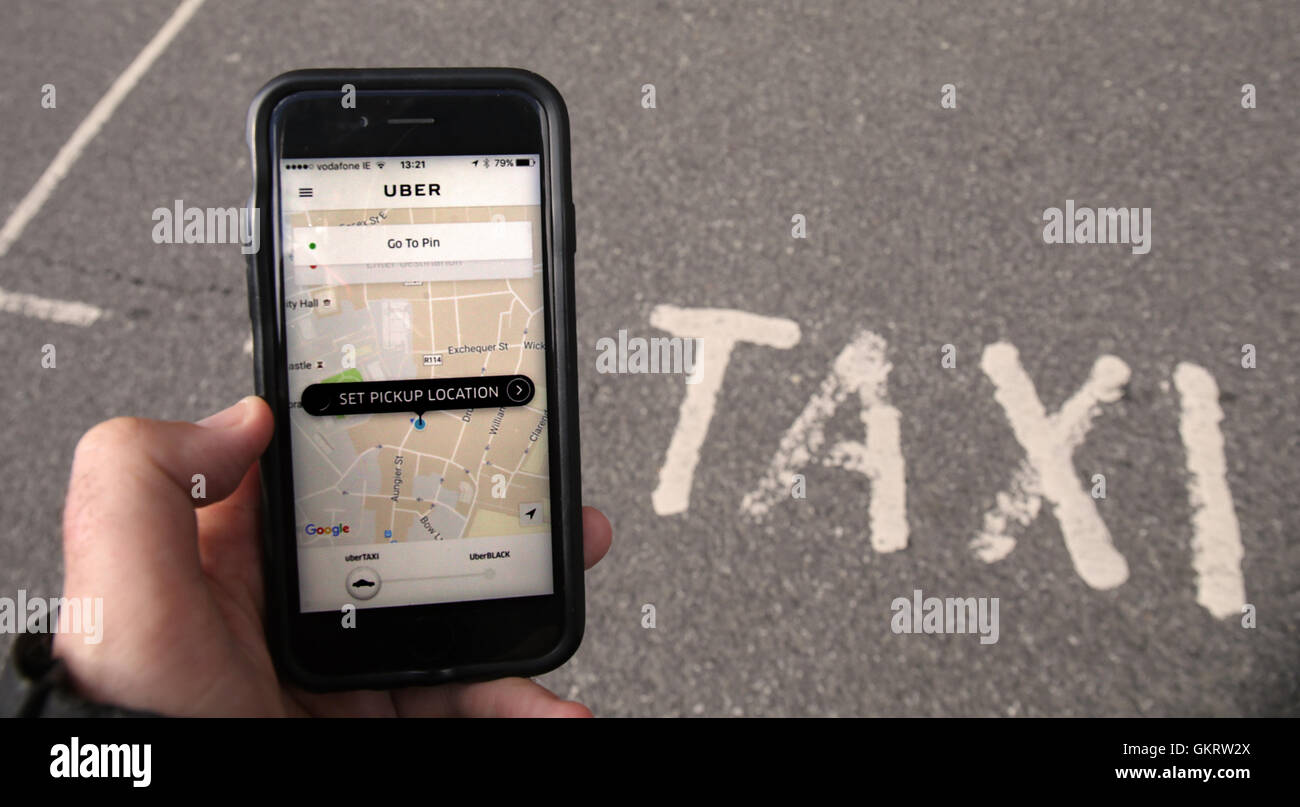 A general view of the Uber app open at a taxi rank in Dublin Stock ...