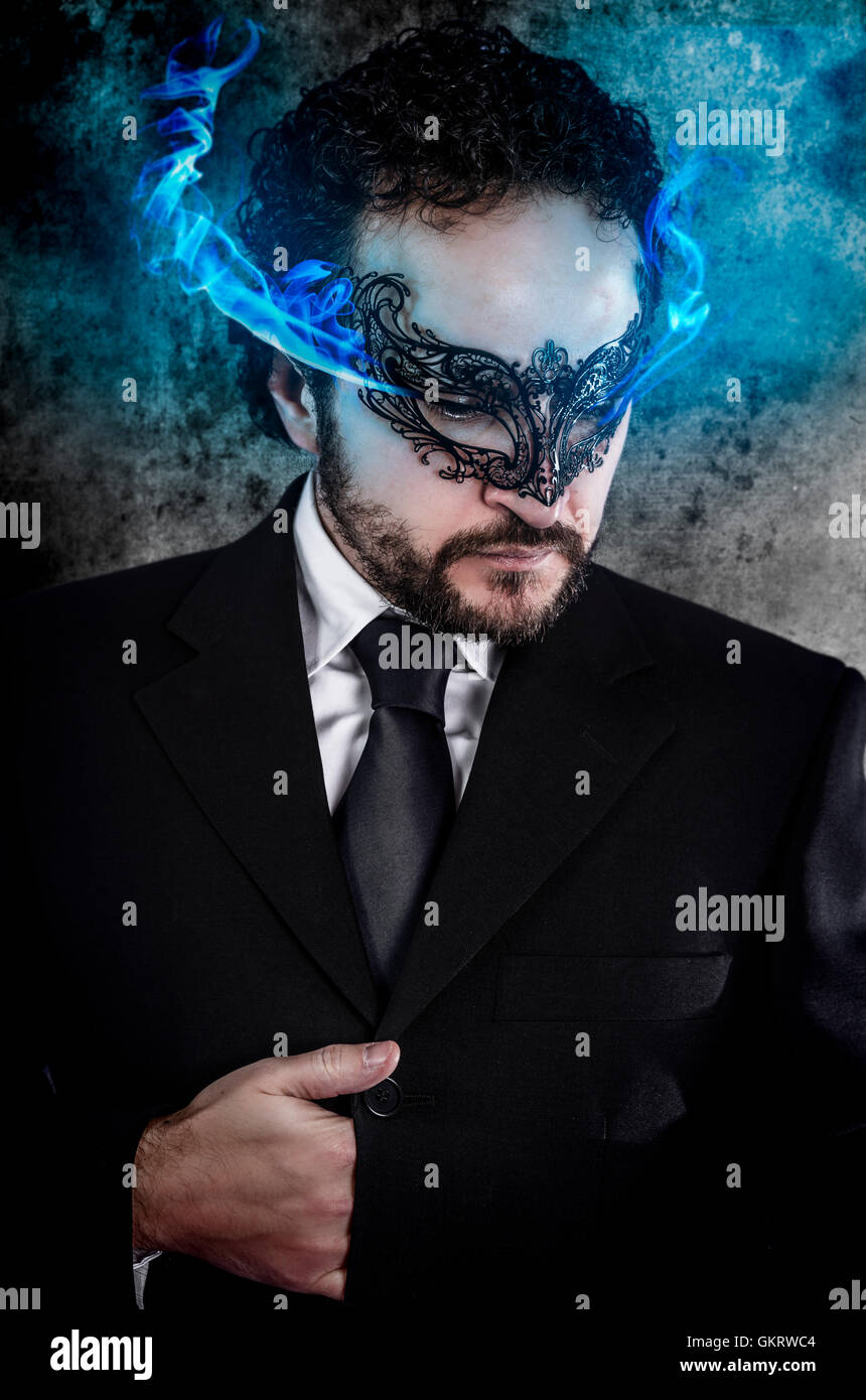concept business, man with fiery eyes and Venetian mask wearing Stock ...