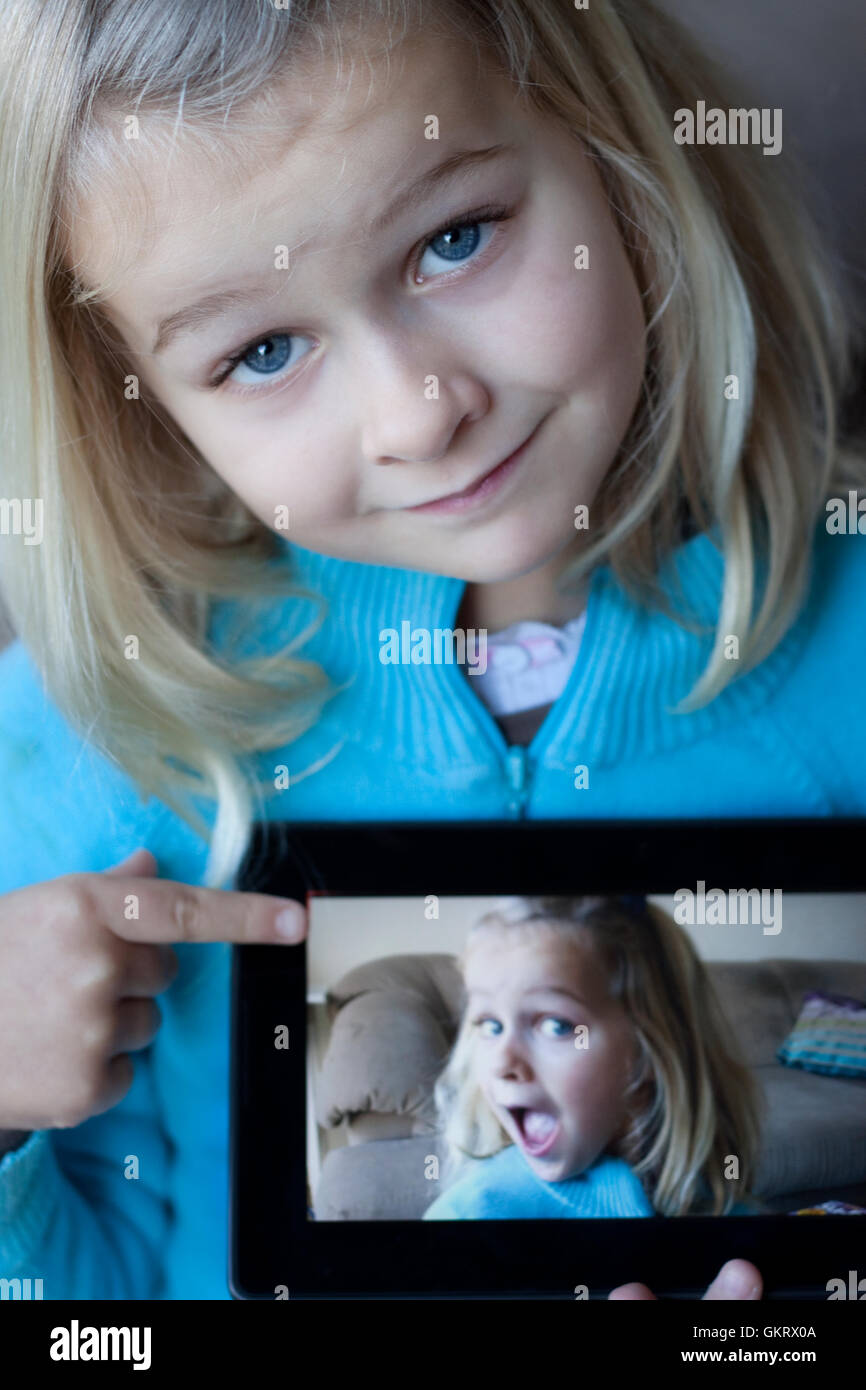 Child holding a tablet Stock Photo - Alamy