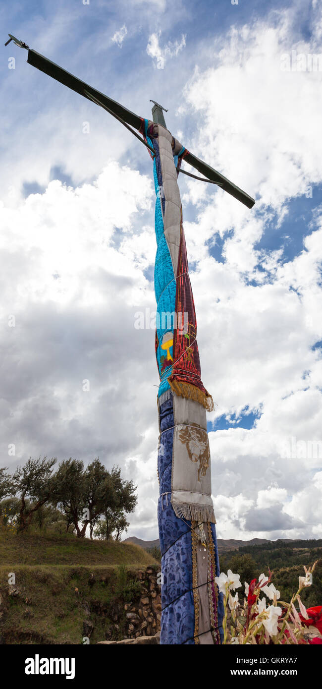 close up of a cross with bright clouds in the background on the ...